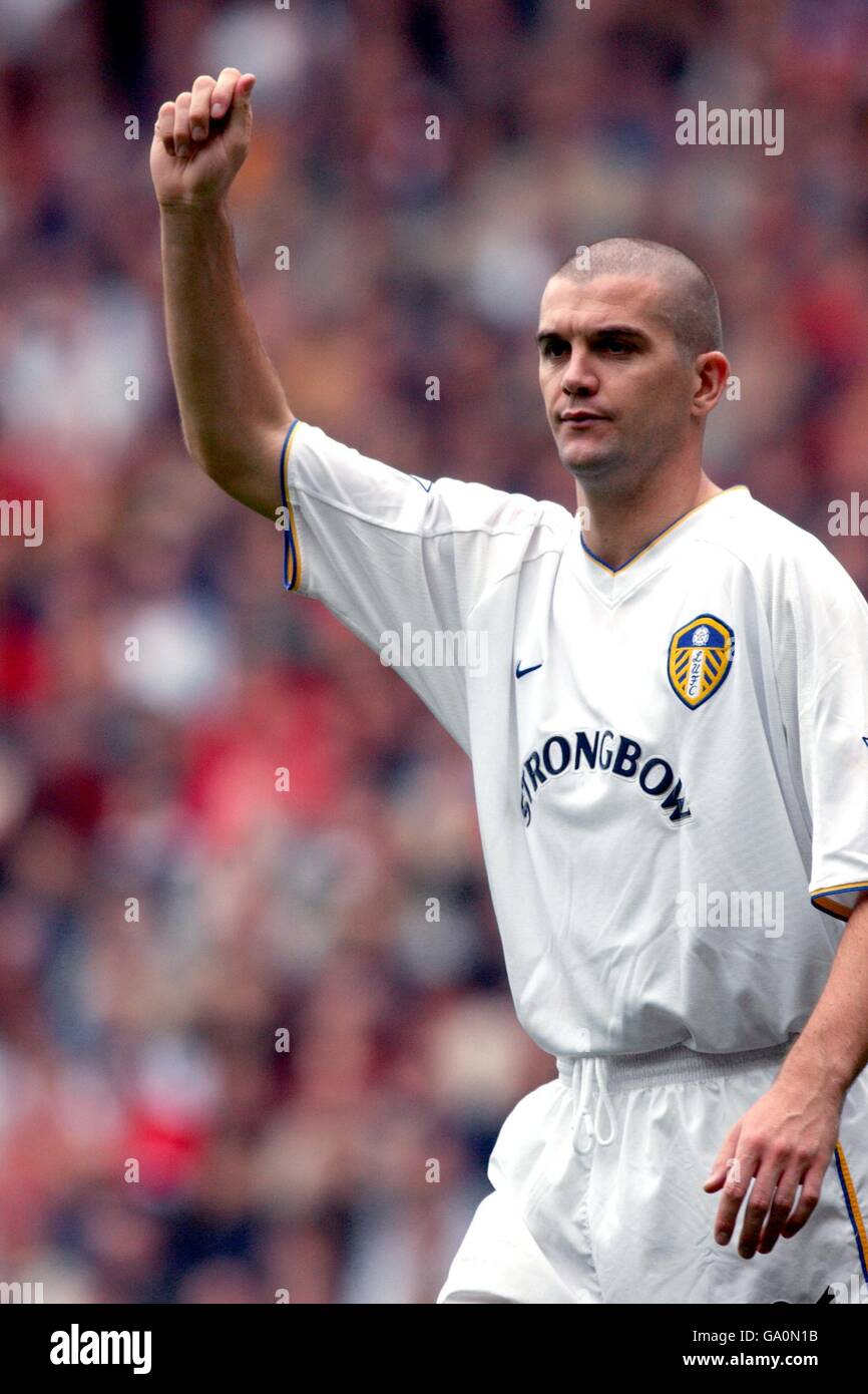 Leeds United's Dominic Matteo does a quick impression of a referee ...