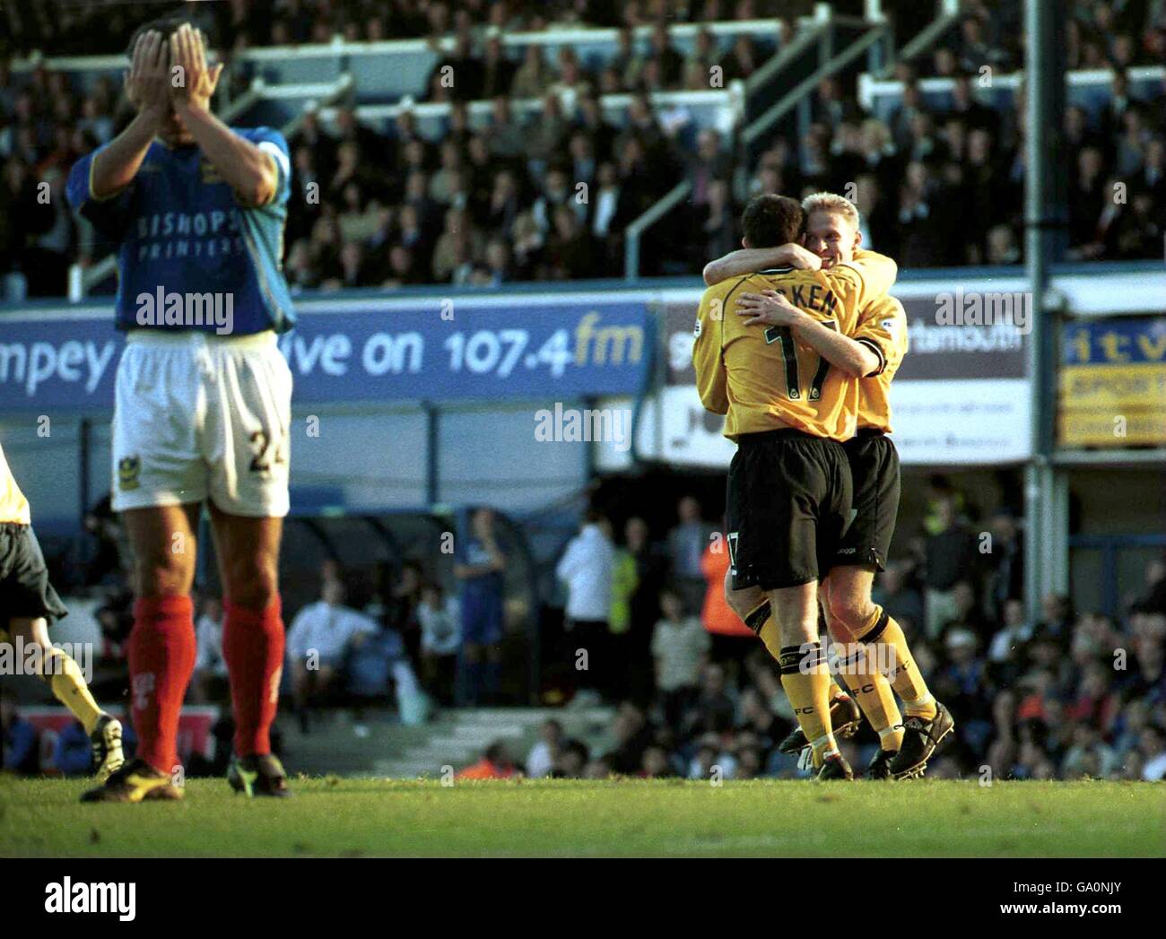 Preston's goalscorer Lee Cartwright is hugged by Jon Macken as ...