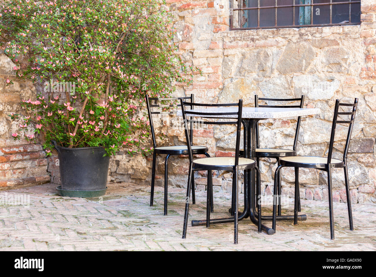 Chairs and table outside a Bar in Tuscany, Italy Stock Photo - Alamy