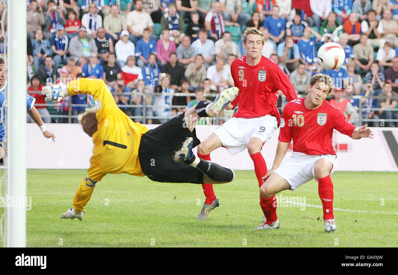 Estonia's goalkeeper Mart Poom saves as England's Michael Owen (right ...