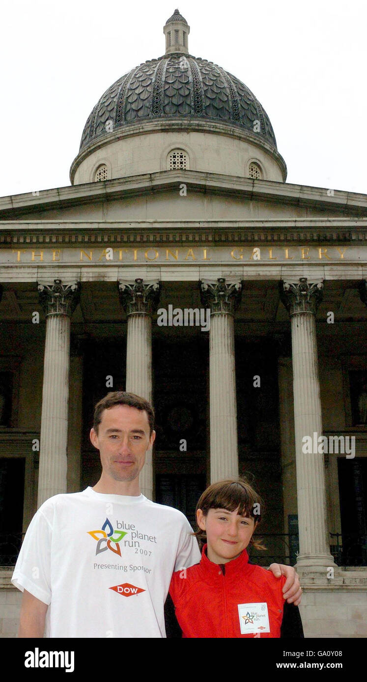 Paul Rogan poses with his daughter Kirstie, 14, after completing a ...