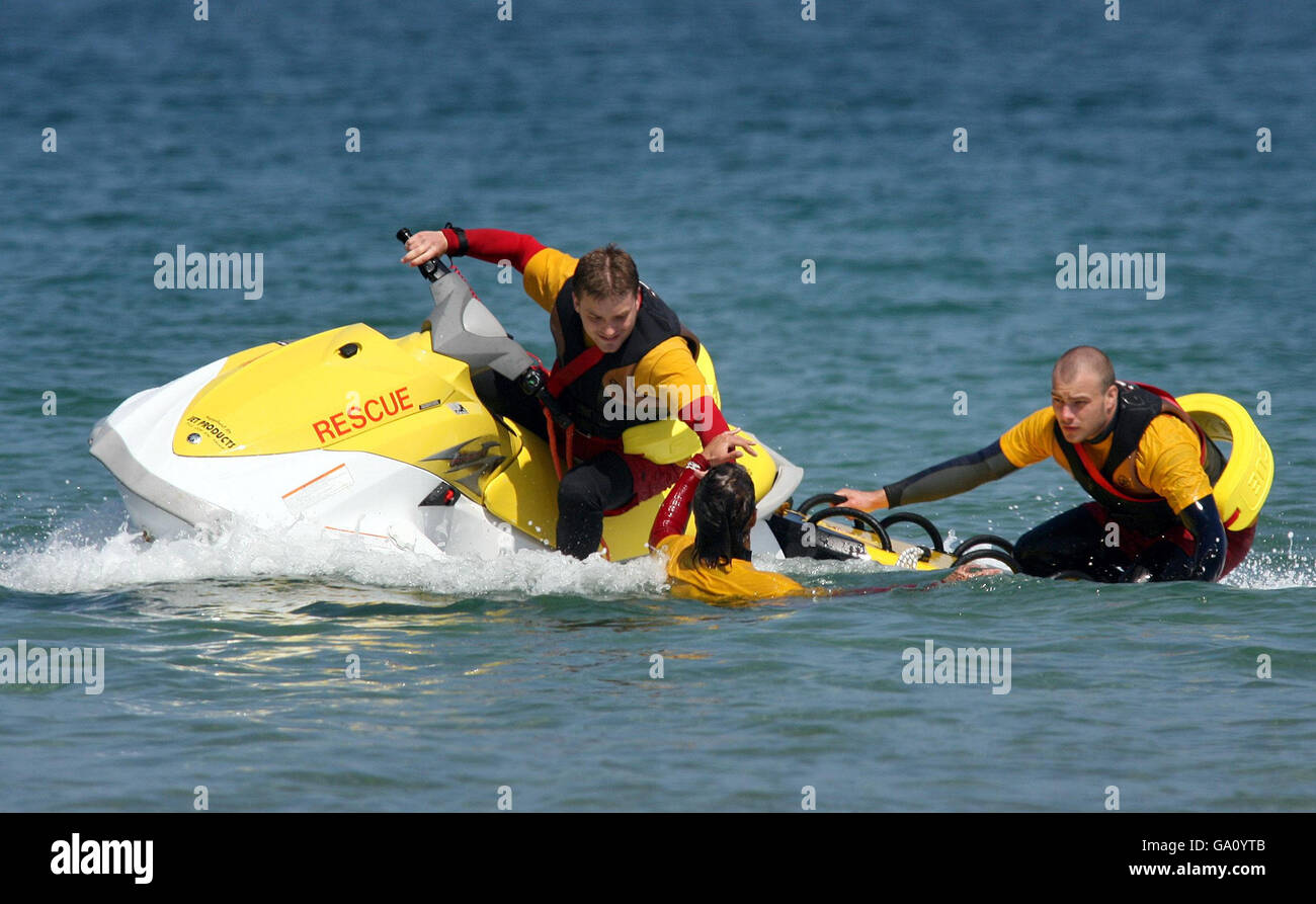 Lifeguards during a practice rescue session at Portrush East Strand in ...