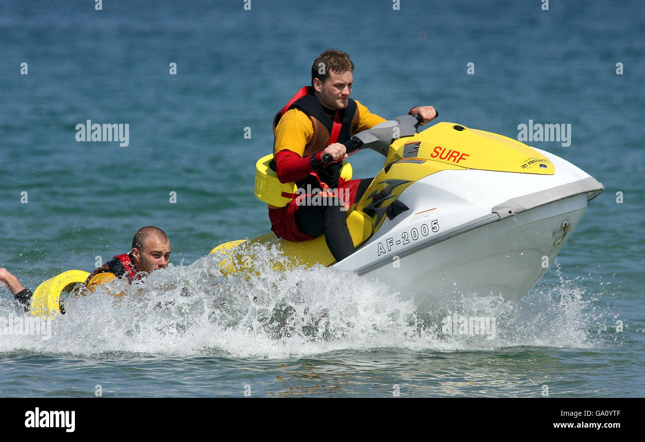 Lifeguards during a practice rescue session at Portrush East Strand in ...