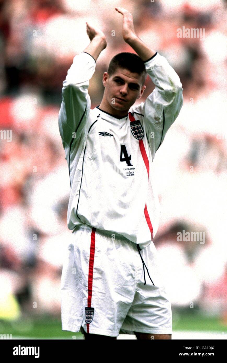 England's Steven Gerrard applauds the crowd at Old Trafford after ...