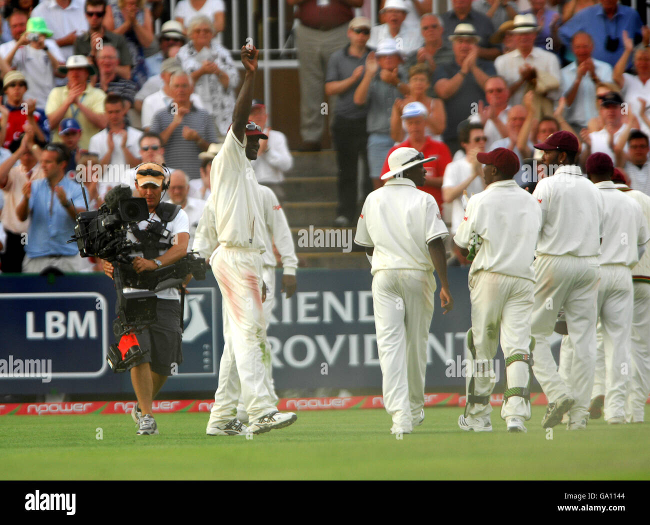 West Indies' Darren Sammy shows the crowd the ball after taking seven ...