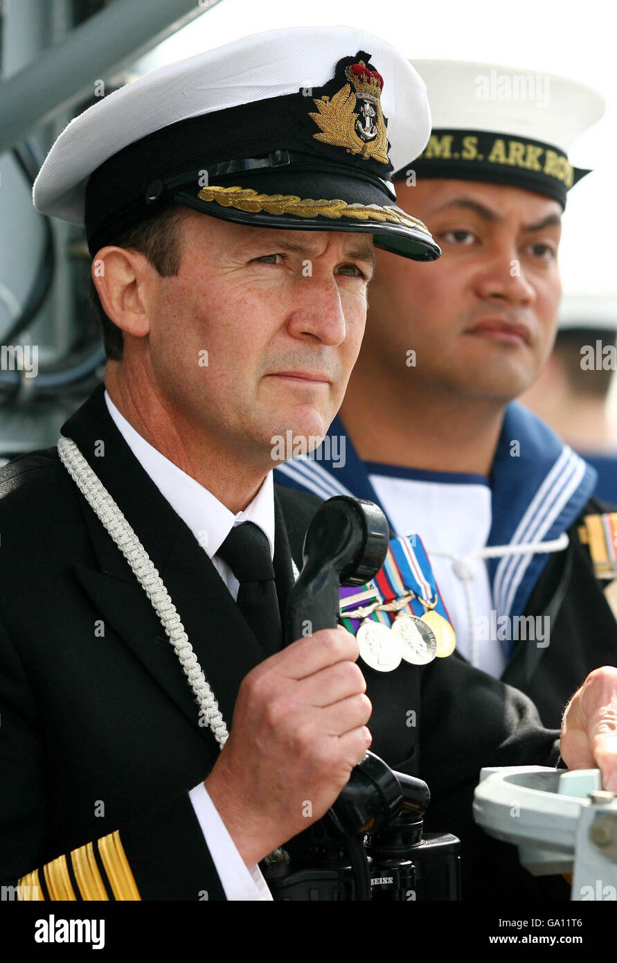 Commanding Officer Captain Mike Mansergh manouvers HMS Ark Royal up the ...