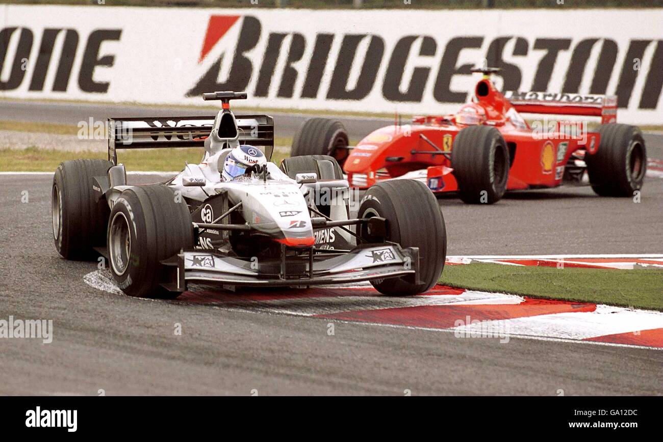 Their last battle? Mika Hakkinen leads Michael Schumacher in the Japanese Grand Prix Stock Photo ...