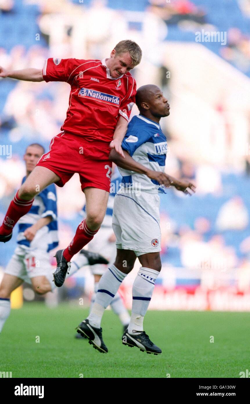 Swindon Town's Alan Reeves beats Reading's Anthony Rougier to the ball ...