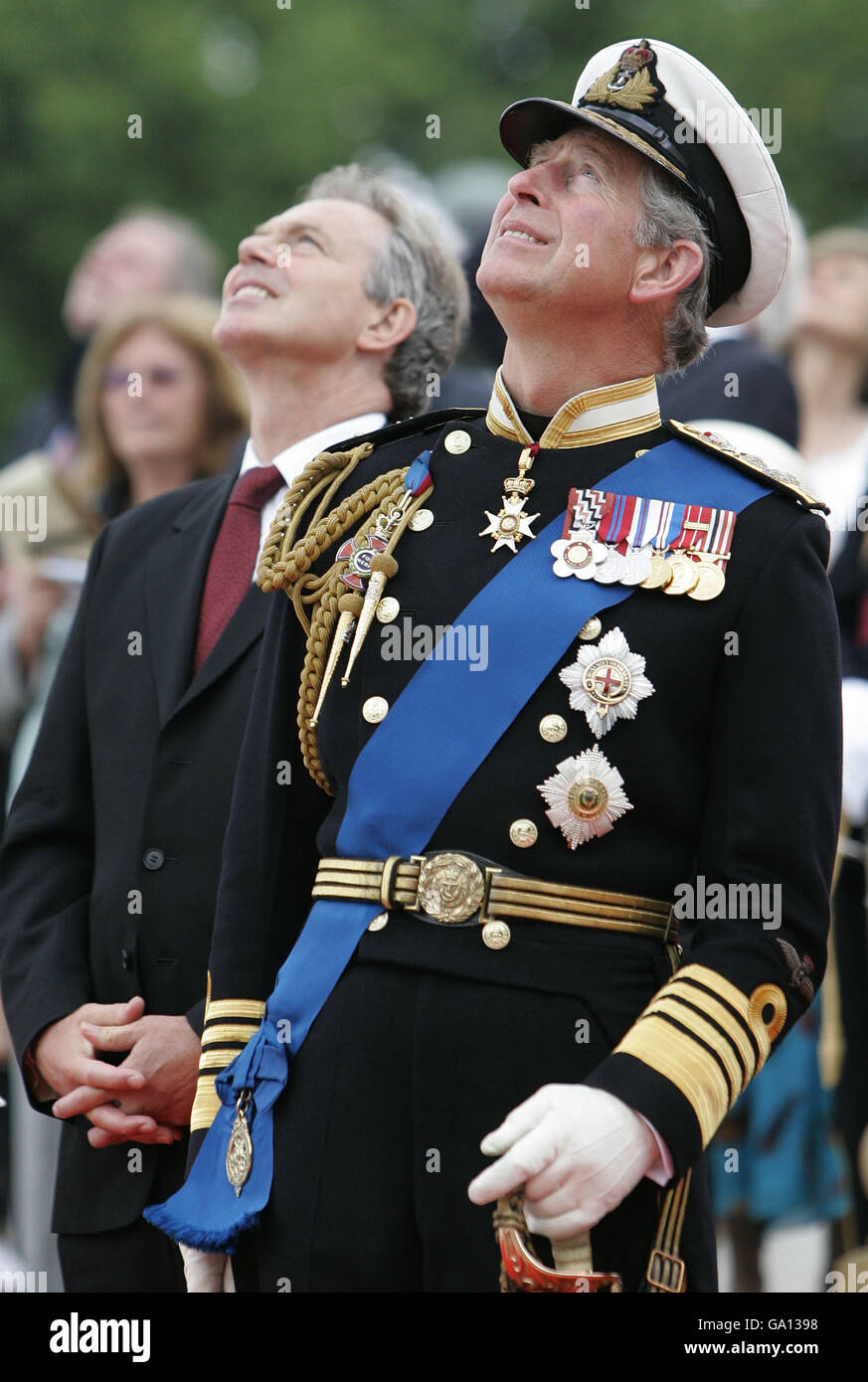 Britain's Prince Charles looks up as aircraft from the Royal Air Force ...