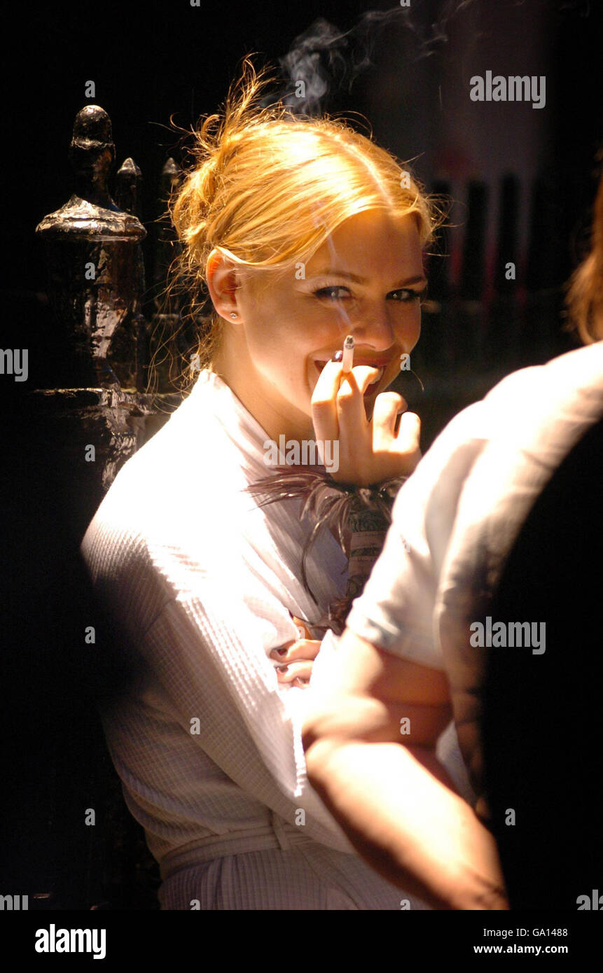 Actress Billie Piper smokes a cigarette during a break in filming for ...