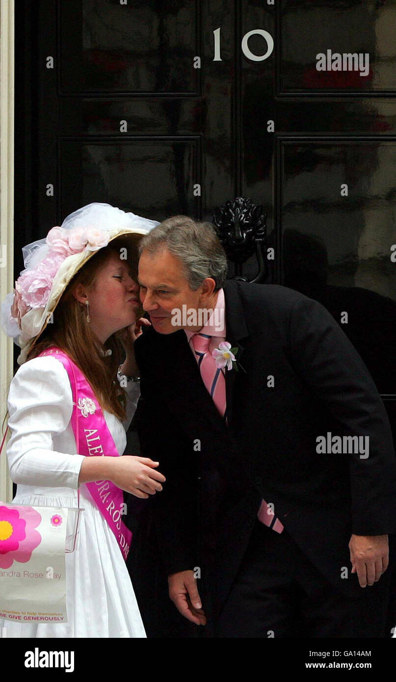 Tony Blair receives a kiss from Alexandra Rose Day collector Emily ...