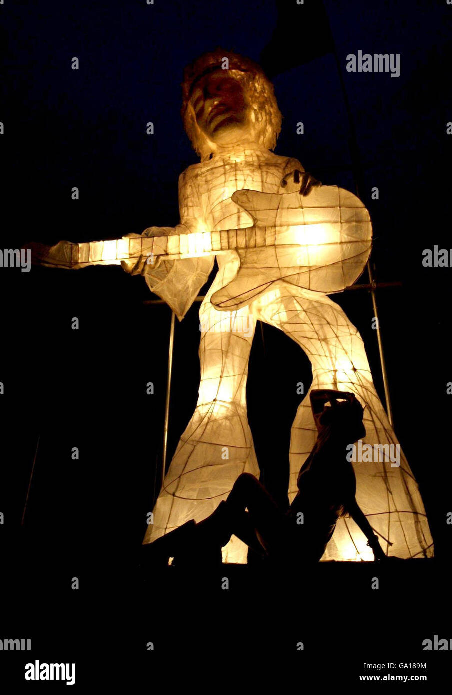 Festival goer Lucy Tigwell, aged 25 from Southampton, poses next to a ...