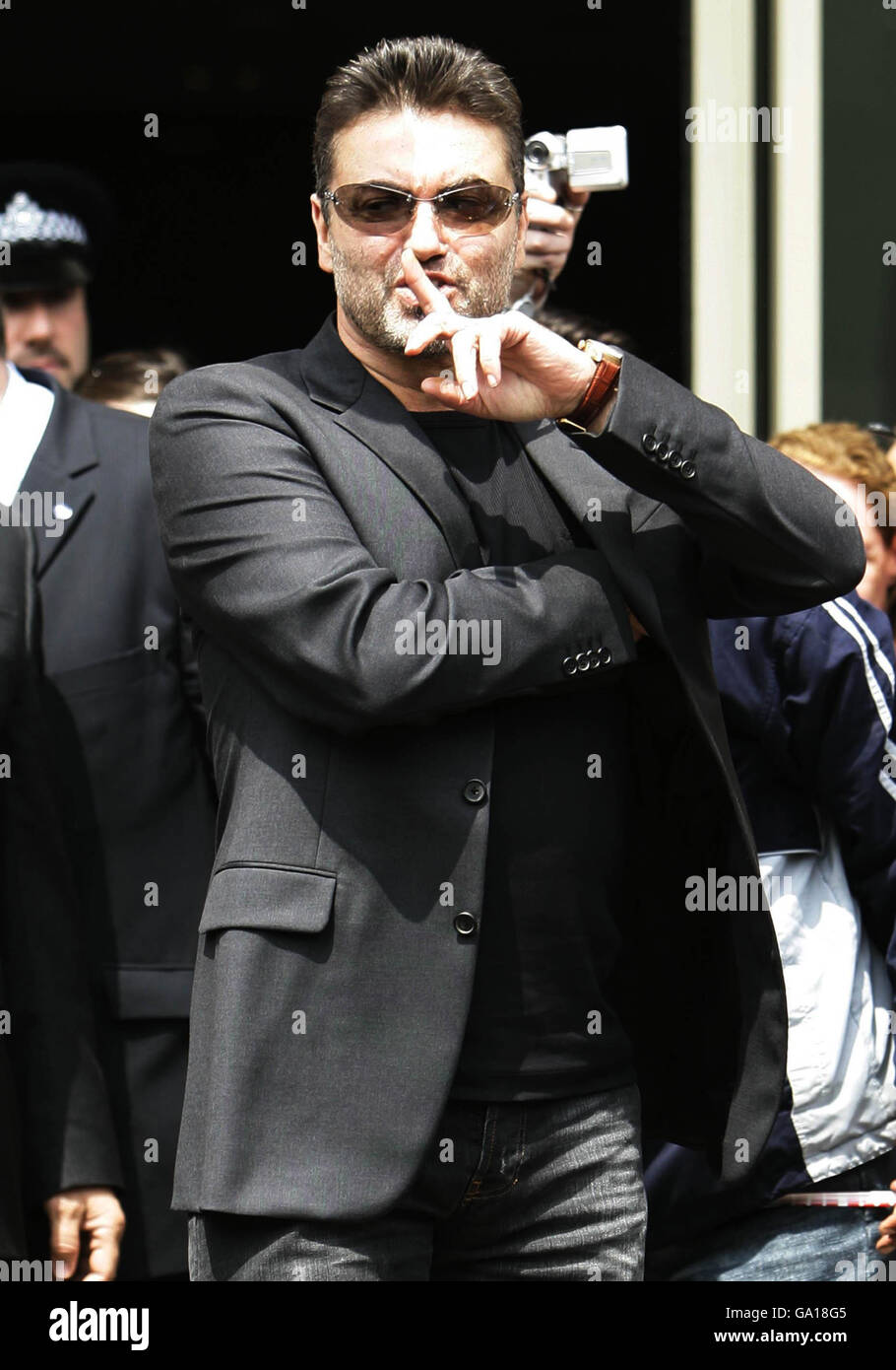 Michael 10. George Michael gestures to the crowd before making a ...
