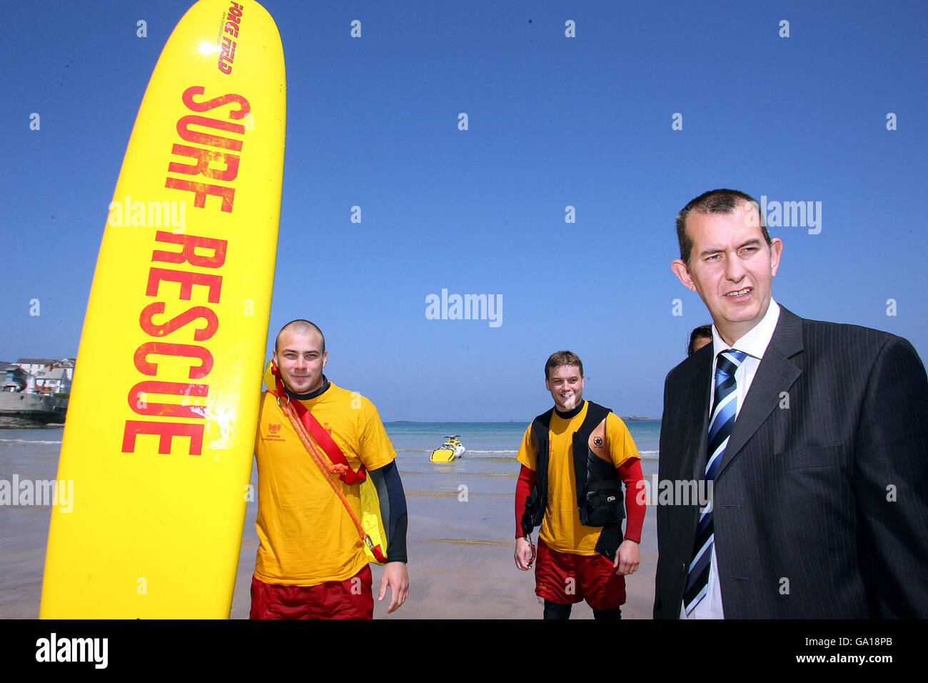 Stormont Culture Minister Edwin Poots (right) at Portrush's east strand ...