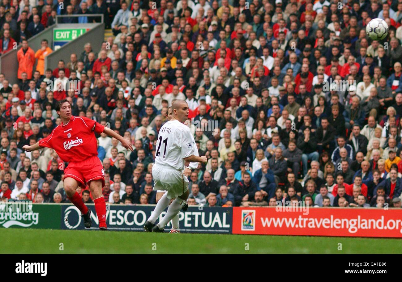 Liverpool's Robbie Fowler sees his chip come back off the bar allowing ...