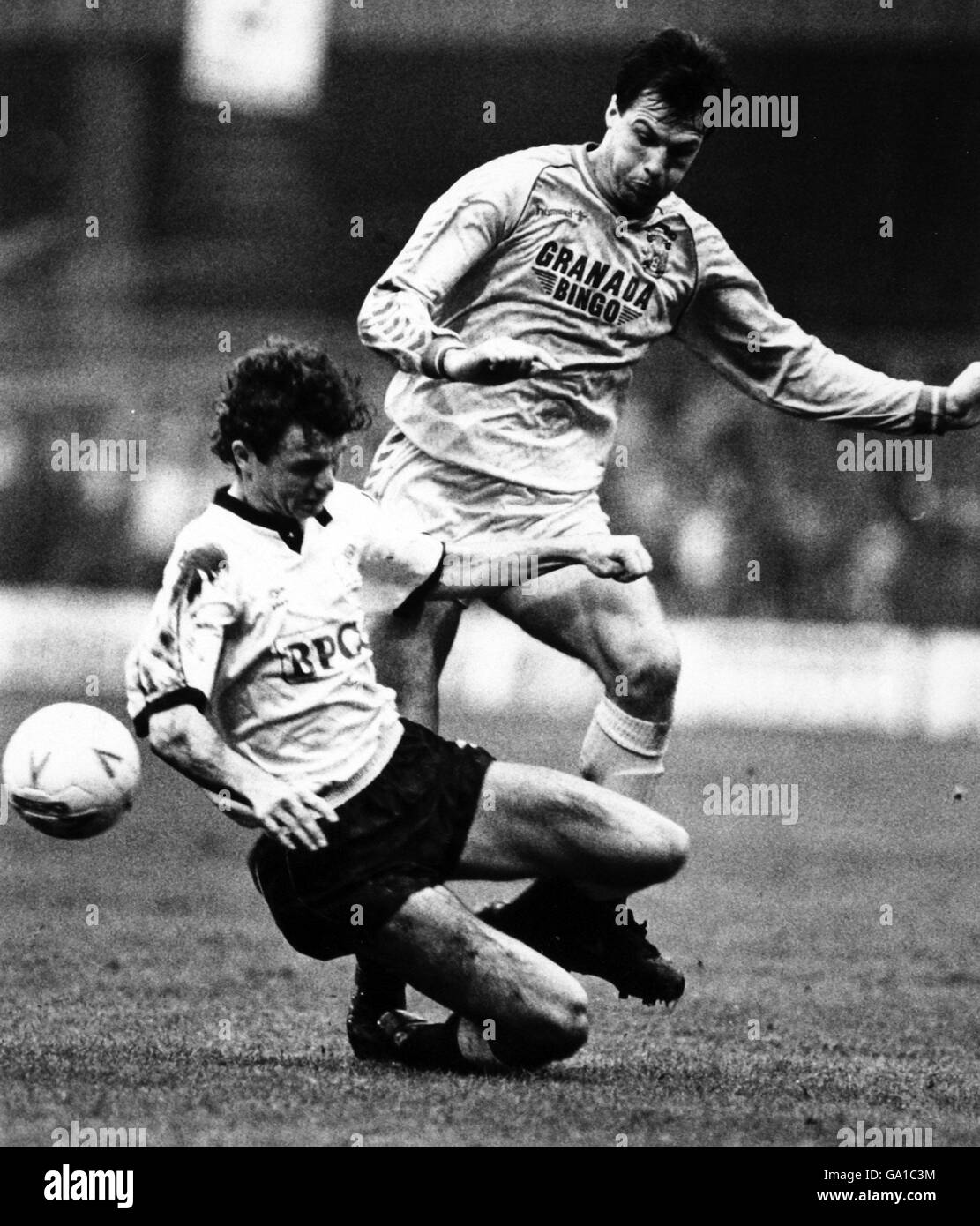 Coventry's Keith Houtchen can find no way past Derby's Michael Forsyth ...