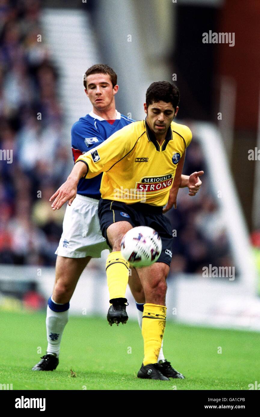 Rangers' Barry Ferguson (l) closely marks Kilmarnock's Jesus Sanjuan (r ...