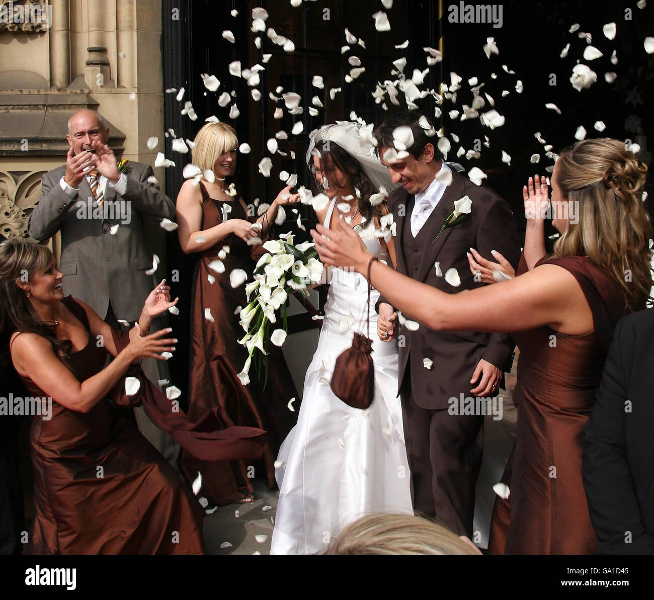Gary Neville and his bride Emma leave Manchester Cathedral shortly ...