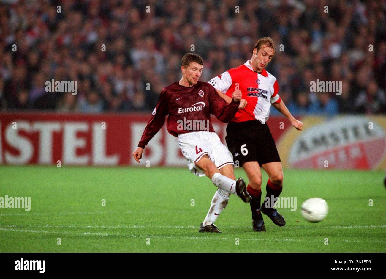 Sparta Prague's Martin Hasek (l) passes the ball under pressure from ...