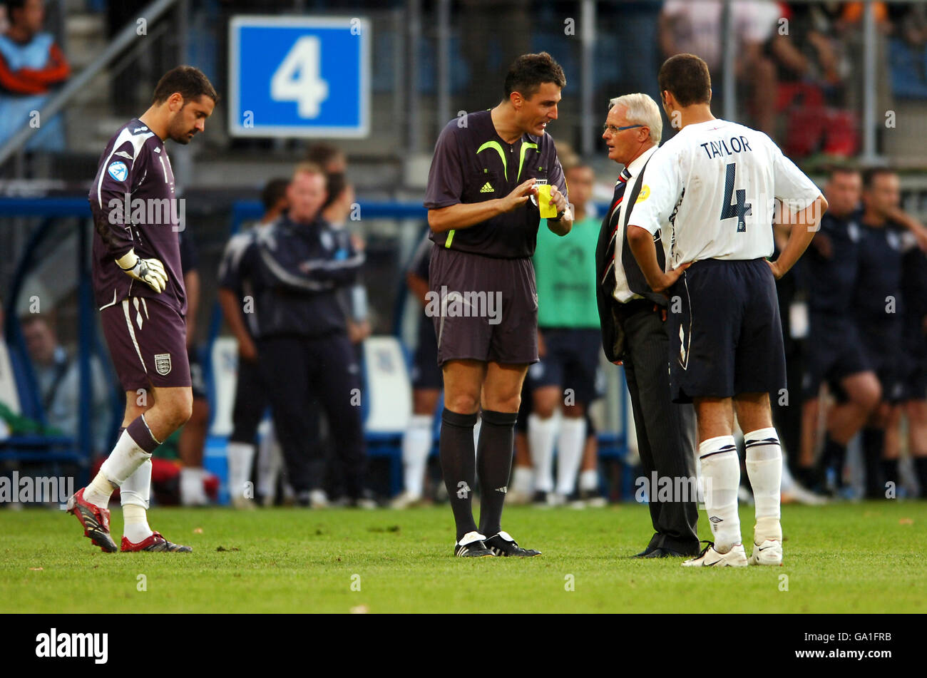 Holland's coach Foppe De Haan is calmed down by referee Knut Kircher ...