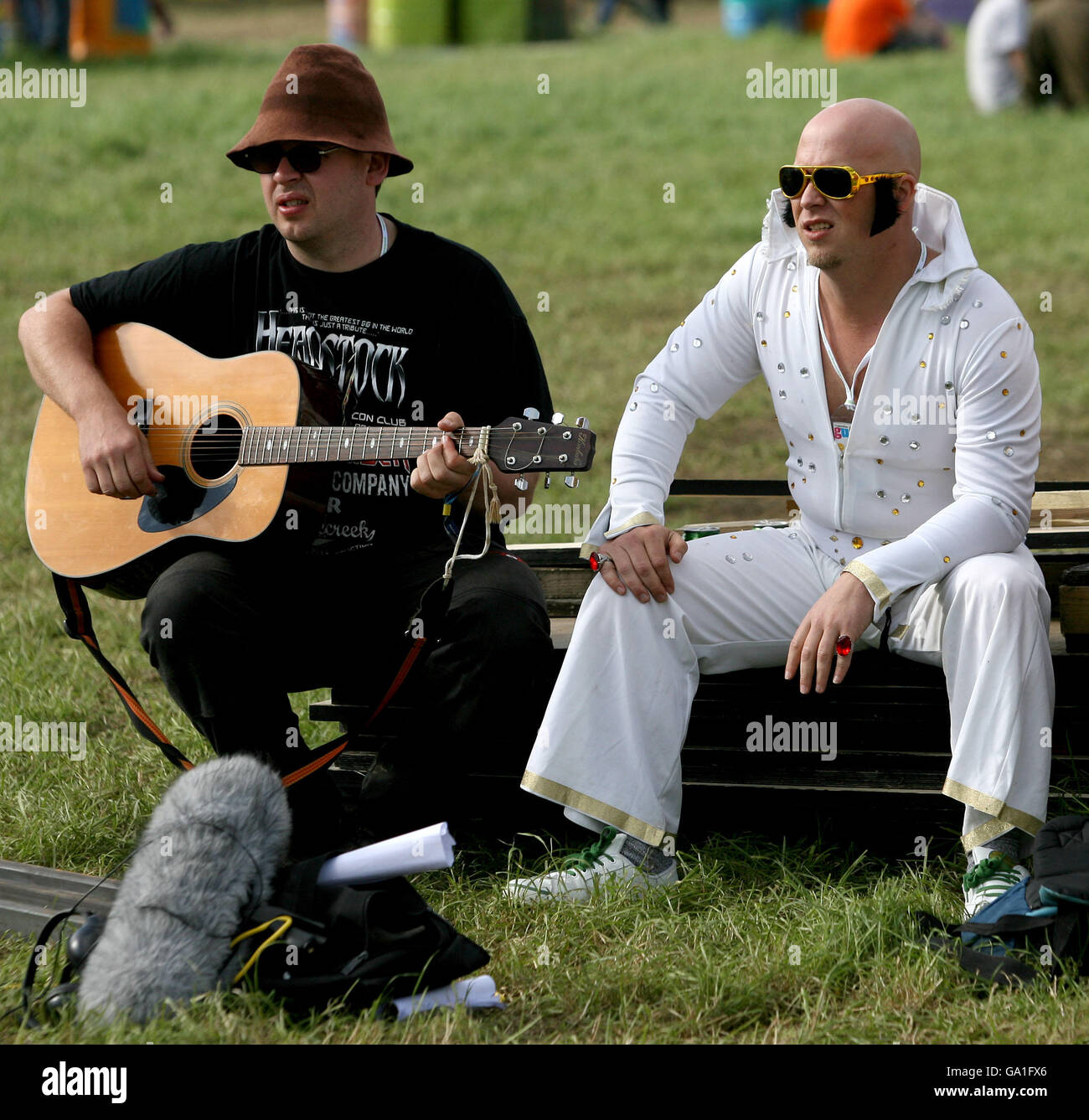 A bald Elvis impressionist is seen at the 2007 Glastonbury Festival at ...