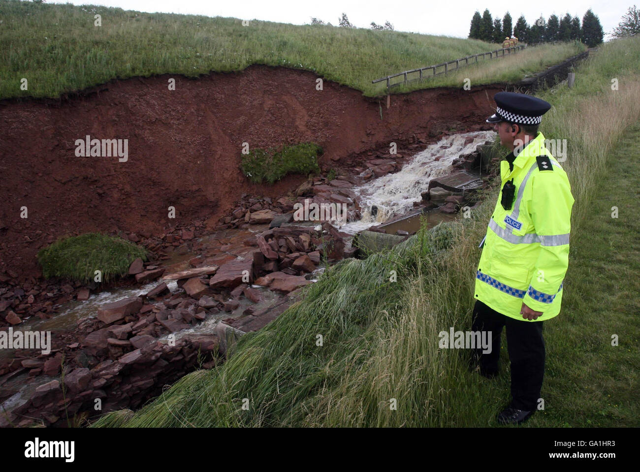 A police officer surveys ulley dam near rotherham hi-res stock ...