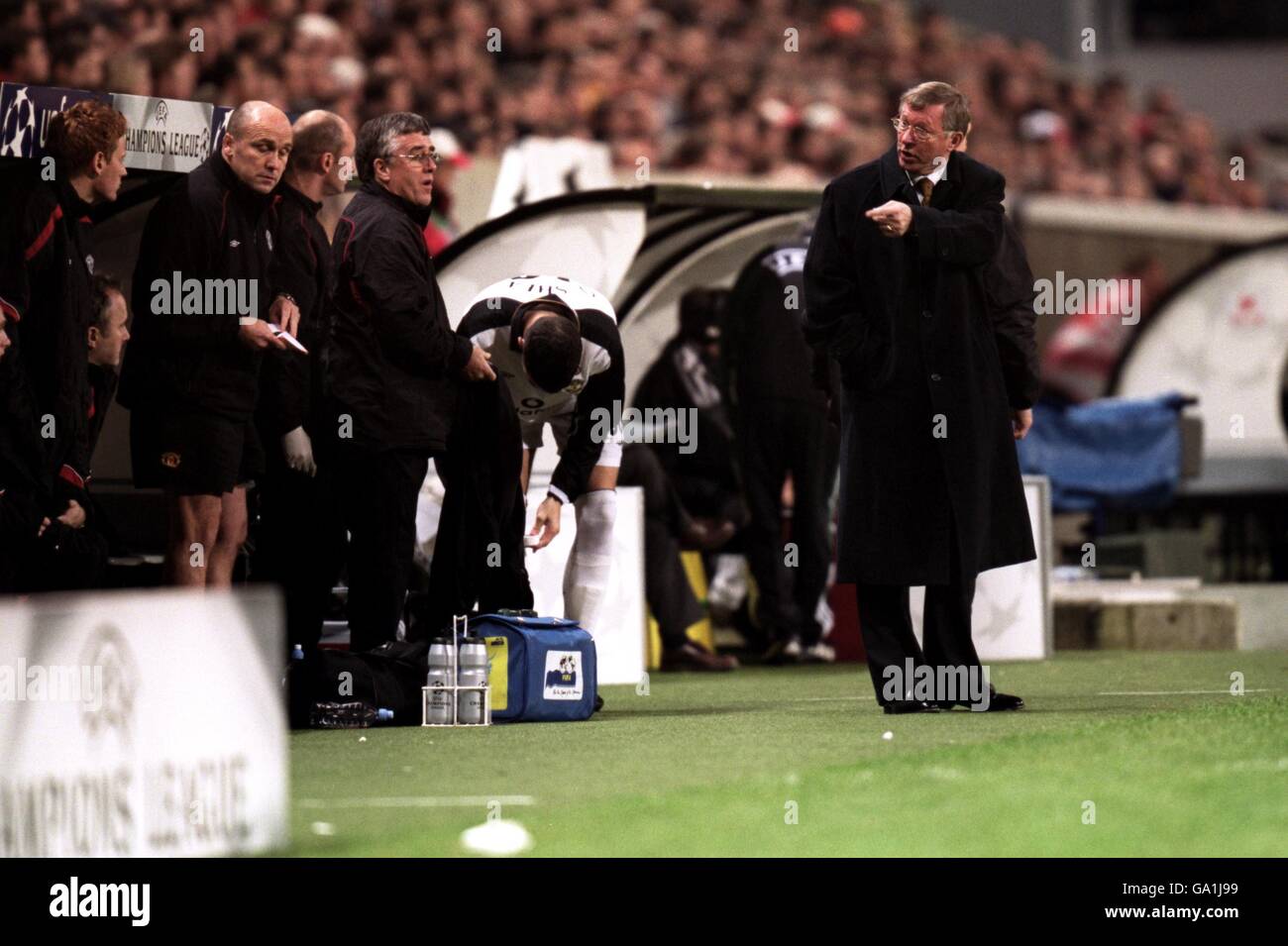 Manchester united manager alex ferguson on the bench hi-res stock ...