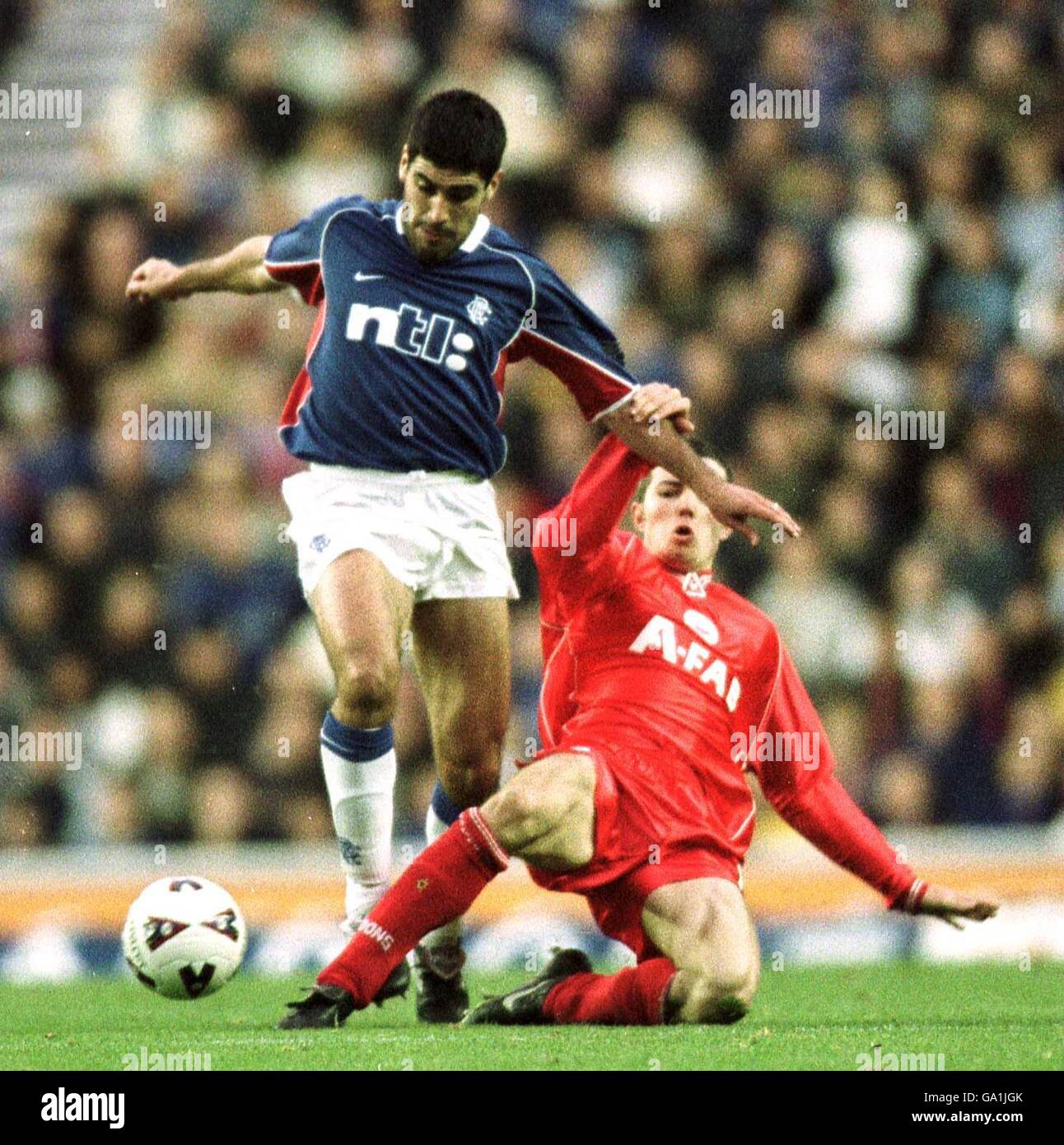 l-r; Rangers' Claudio Reyna is tackled by Aberdeen's Kevin McNaughton ...