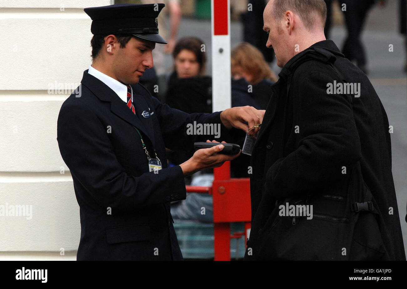 Security use special barcode scanners to check accredited personnel ...