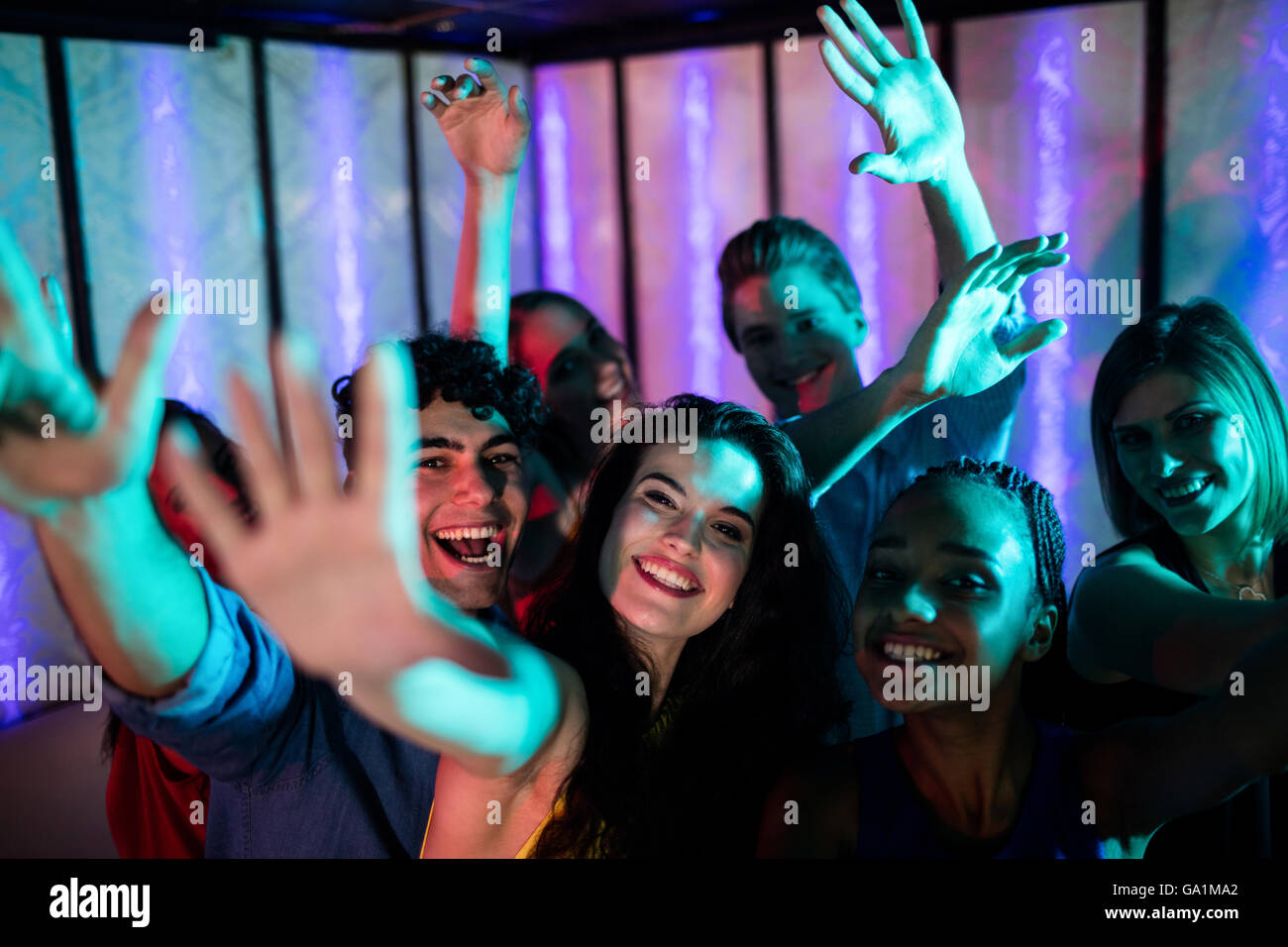 Group of smiling friends dancing on dance floor Stock Photo - Alamy