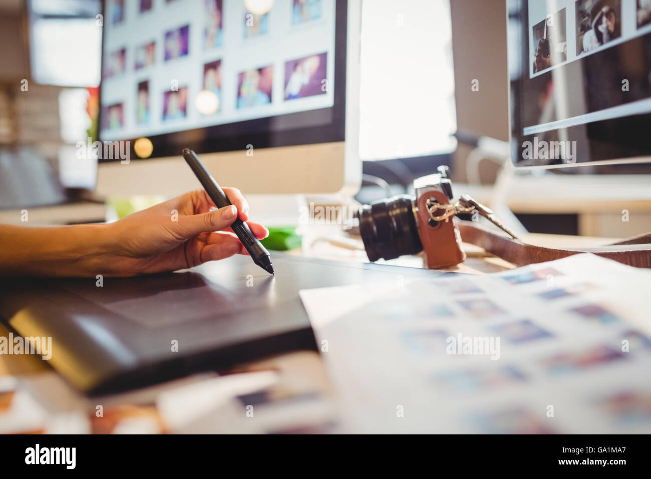 Graphic designer using graphic tablet Stock Photo - Alamy