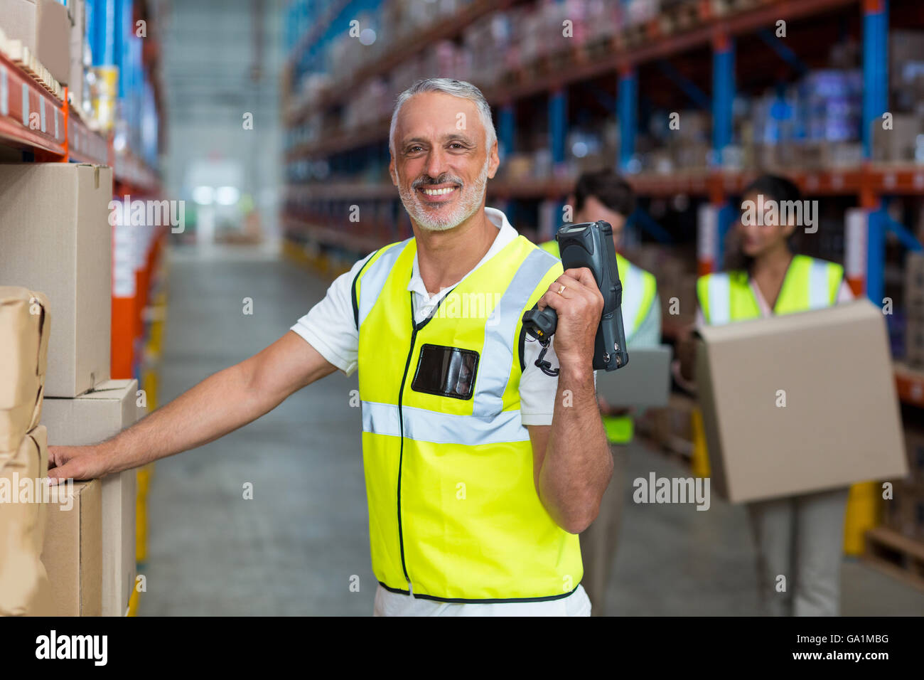 Focus of worker is smiling and posing during work Stock Photo - Alamy