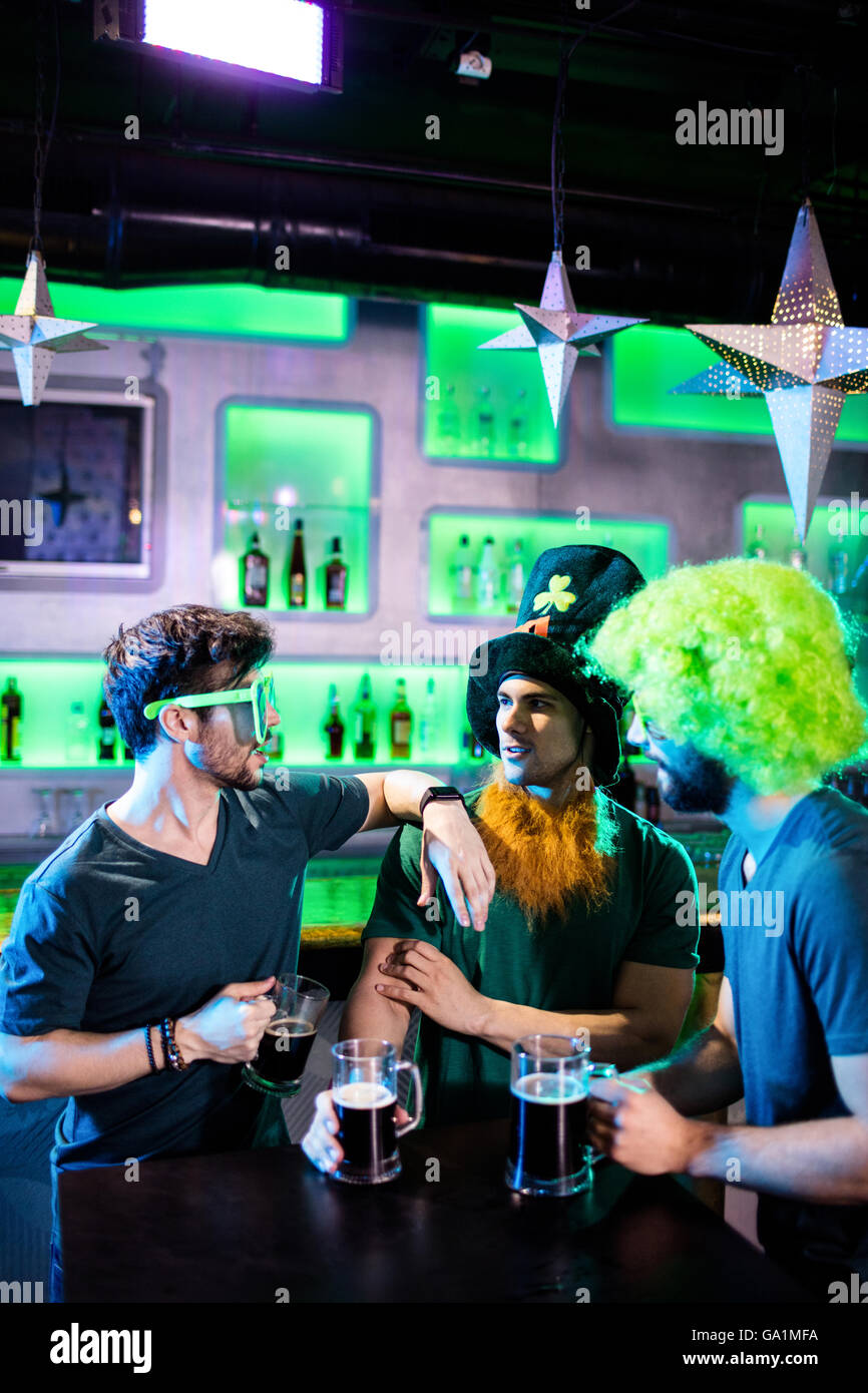 Male friends interacting with each other Stock Photo - Alamy