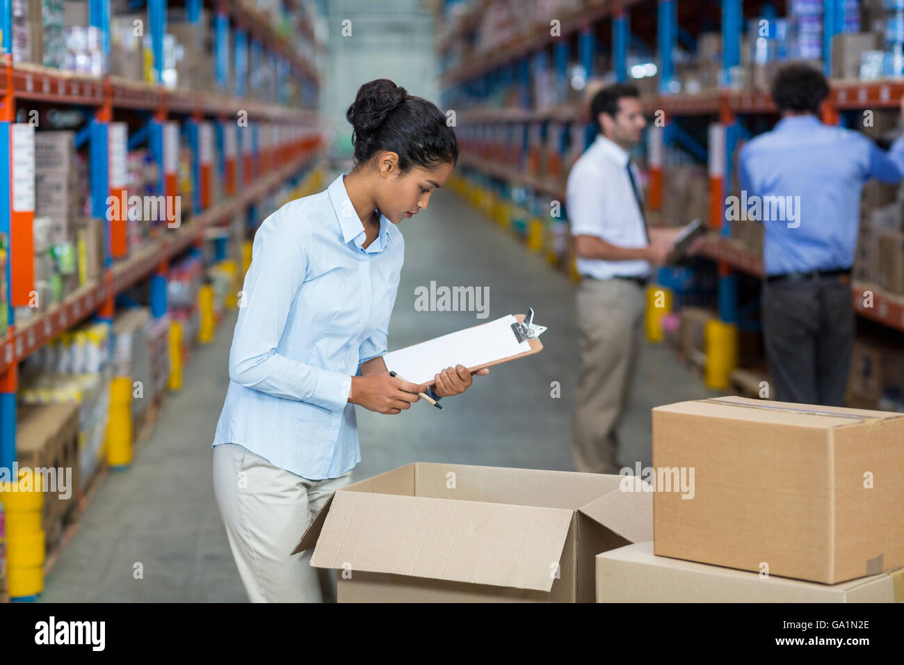 Focus of manager is checking some cardboard boxes Stock Photo - Alamy