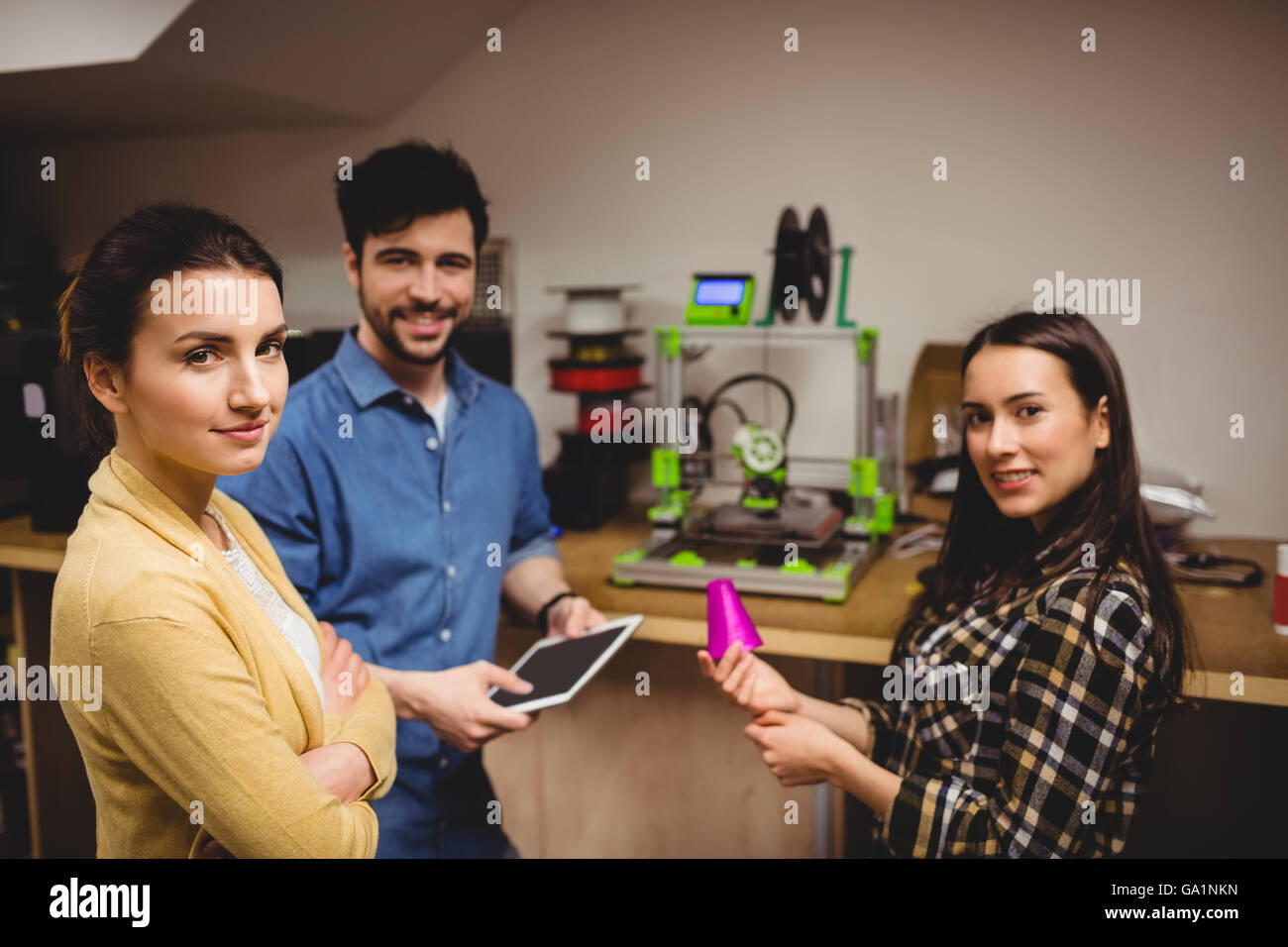 Graphic designers standing in office Stock Photo - Alamy