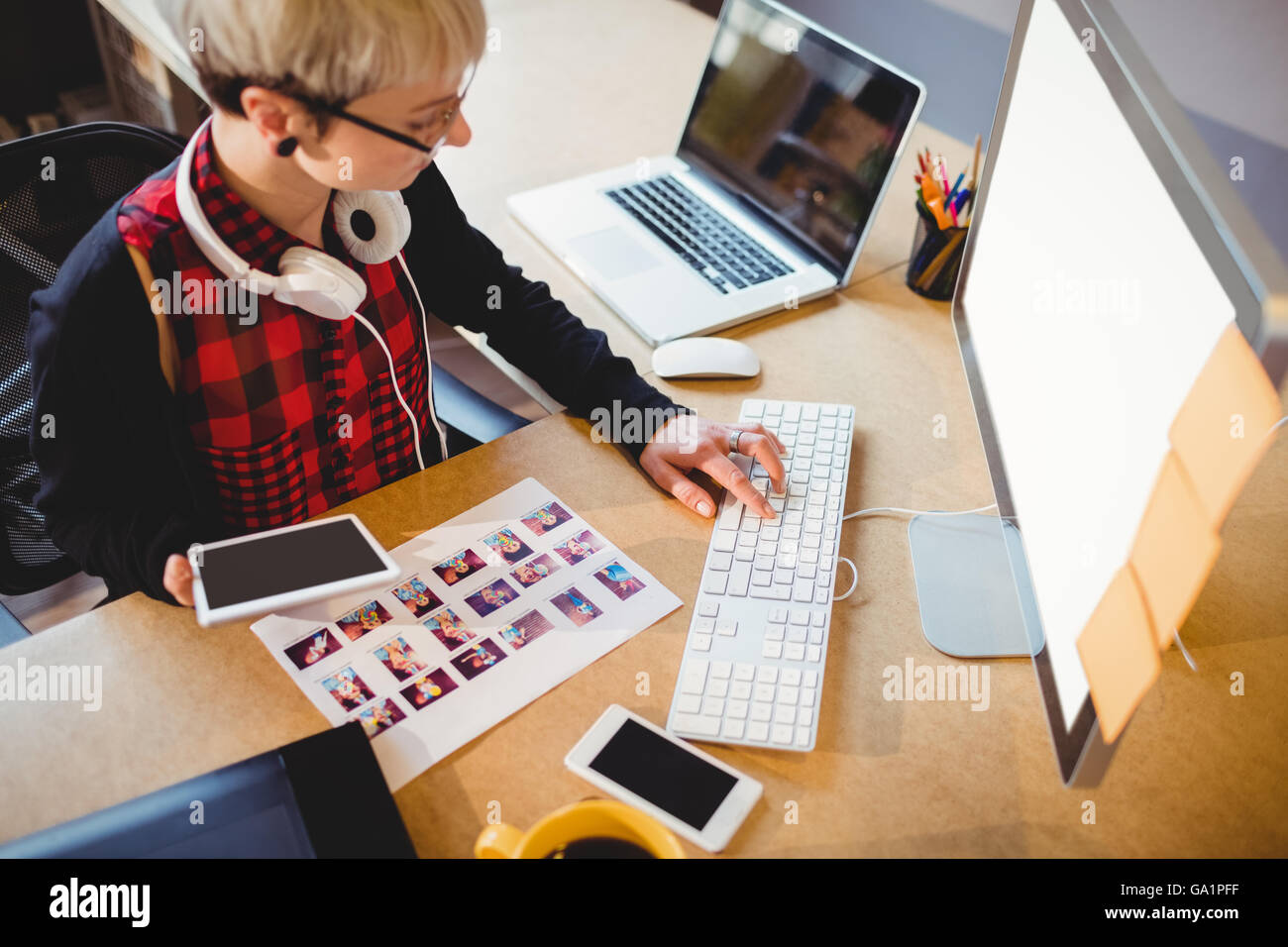 Graphic designer working on computer Stock Photo - Alamy