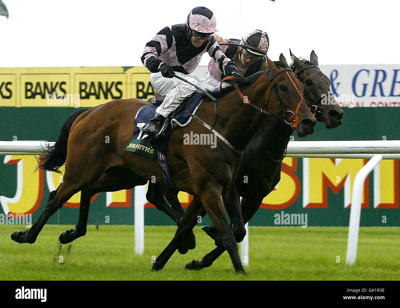 Juniper Girl ridden by Luke Morris (far side) gets ahead of Macorville ...