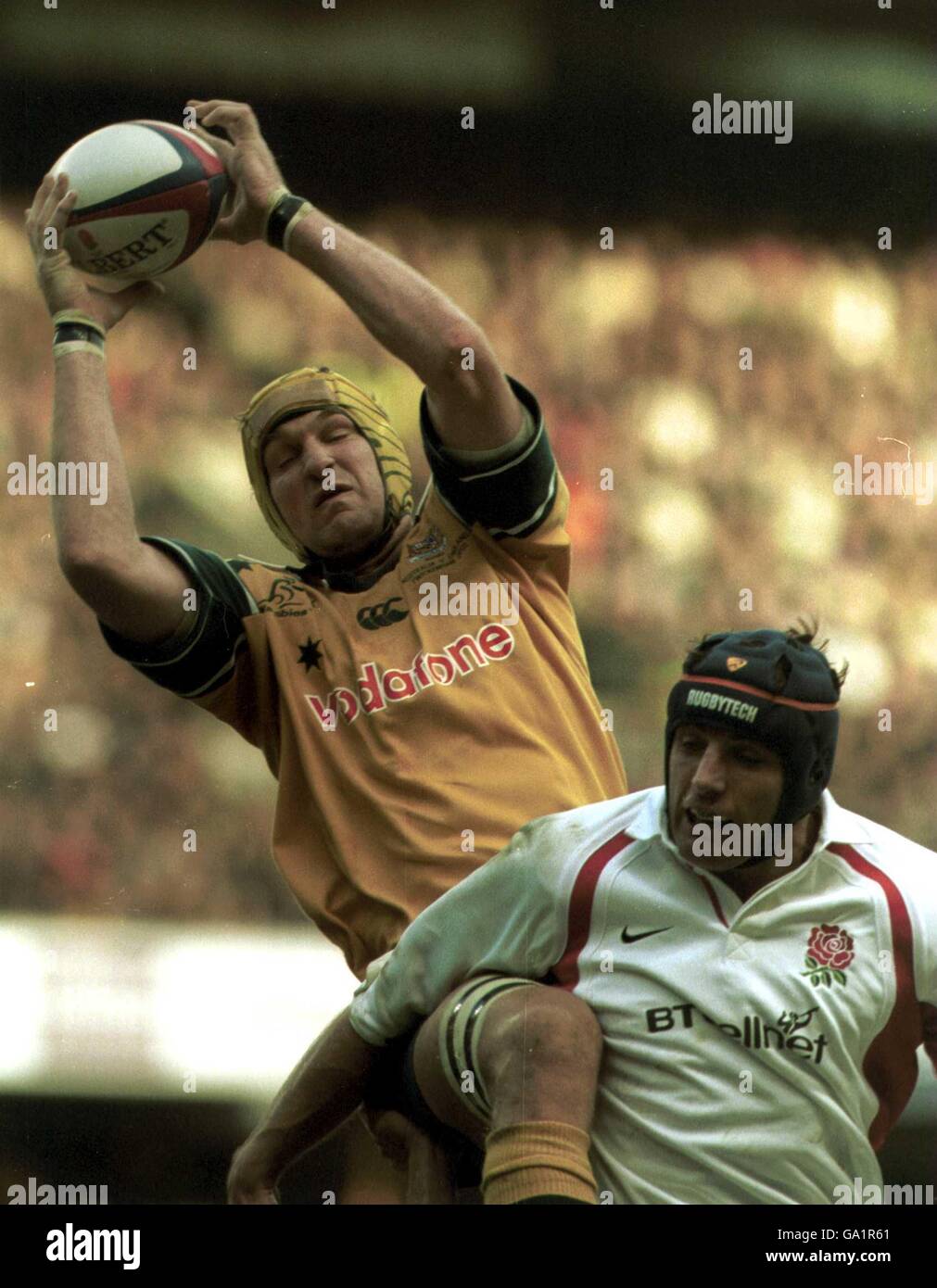 Australias justin harrison takes lineout ball over englands danny ...