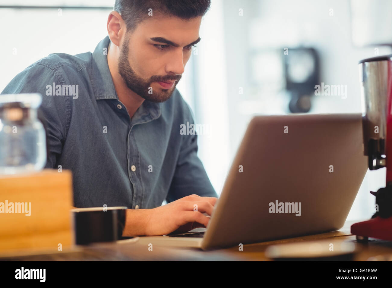 Graphic designer working on laptop Stock Photo - Alamy