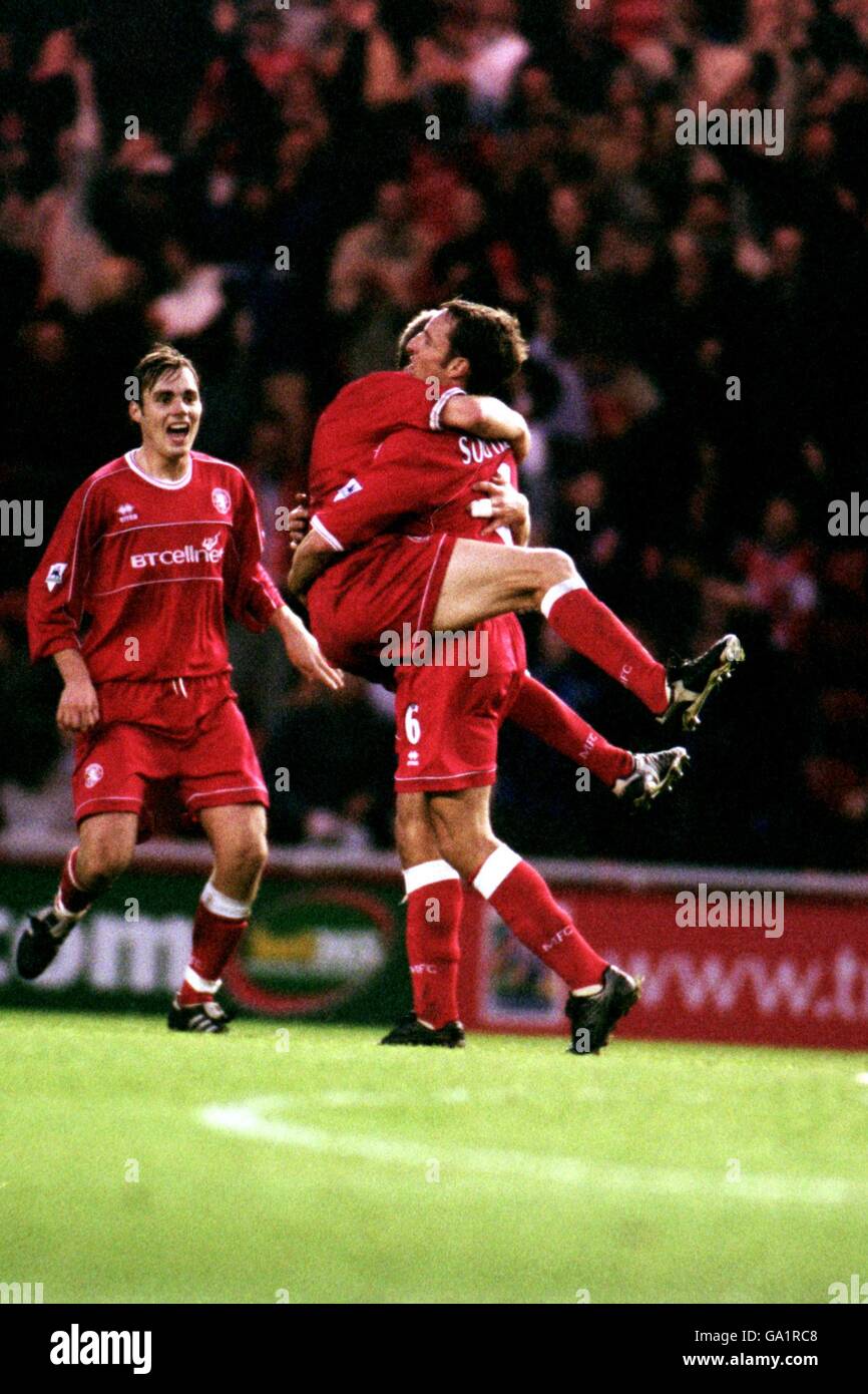 Middlesbrough's Robbie Mustoe (c) hugs teammate Gareth Southgate (r ...