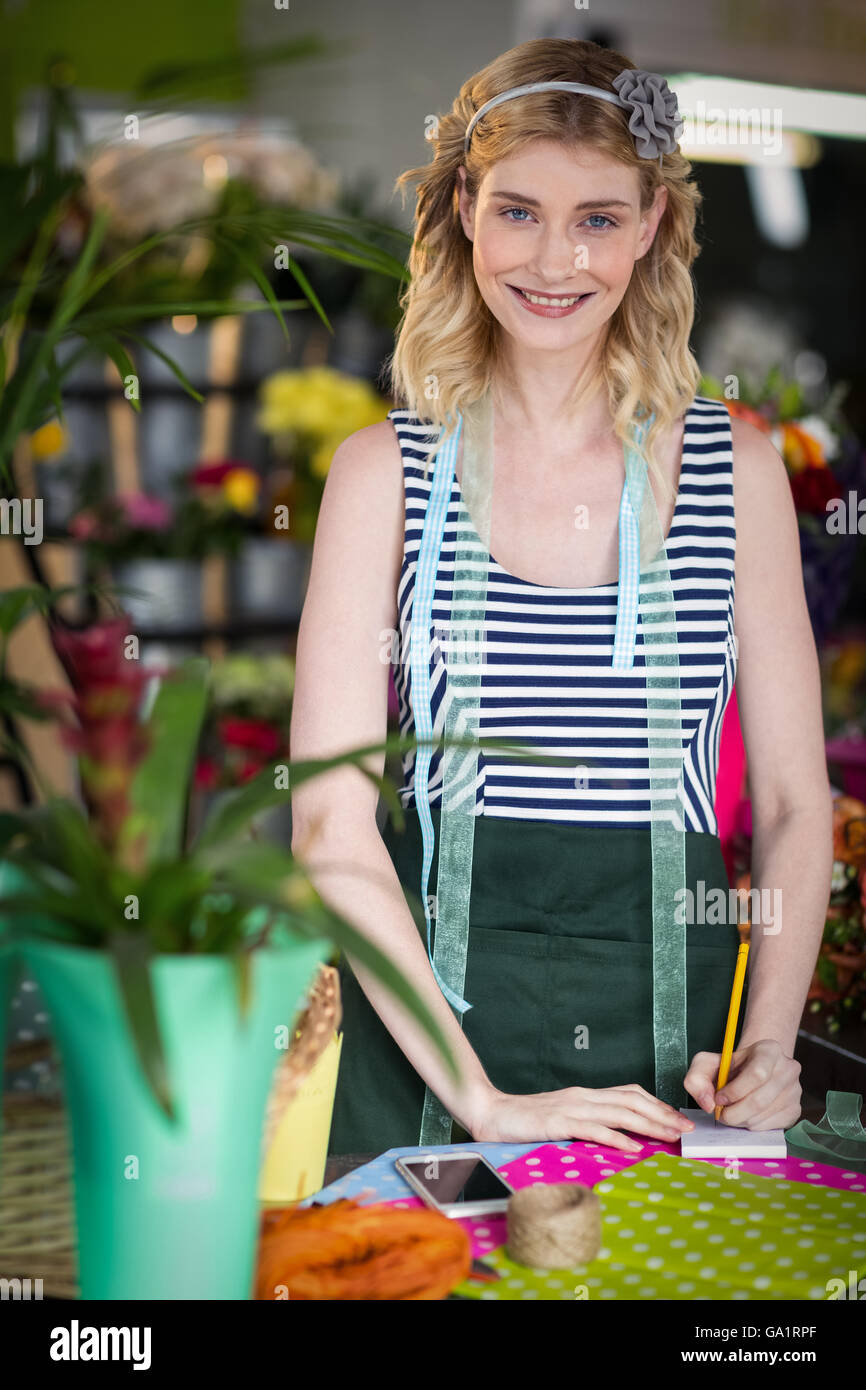 Female owner writing on hi-res stock photography and images - Alamy