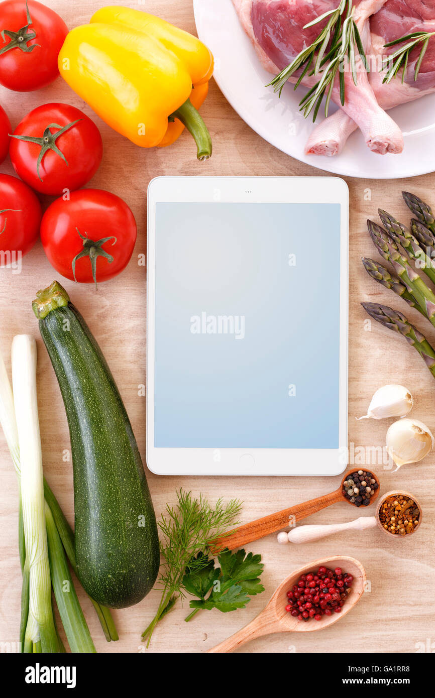 Cooking background with food ingredients and tablet Stock Photo - Alamy