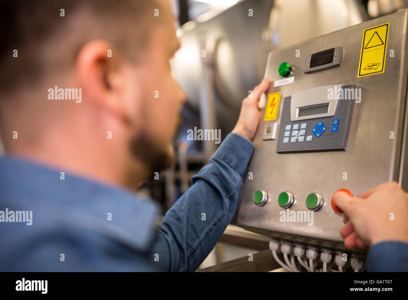 Worker operating hi-res stock photography and images - Alamy