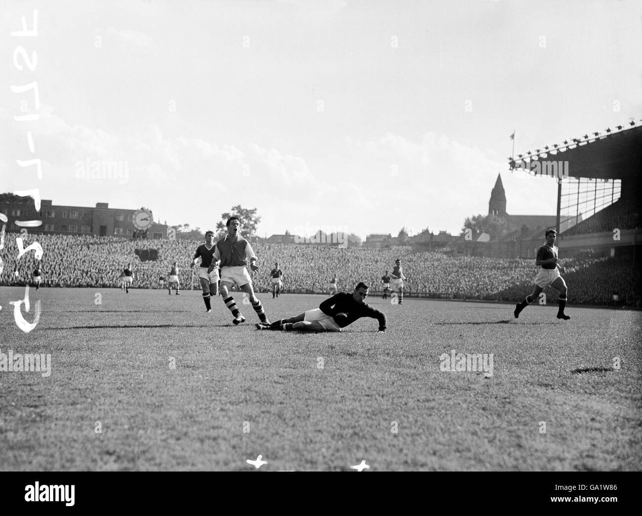 (L-R) Arsenal's Derek Tapscott cries out in frustration after his shot ...
