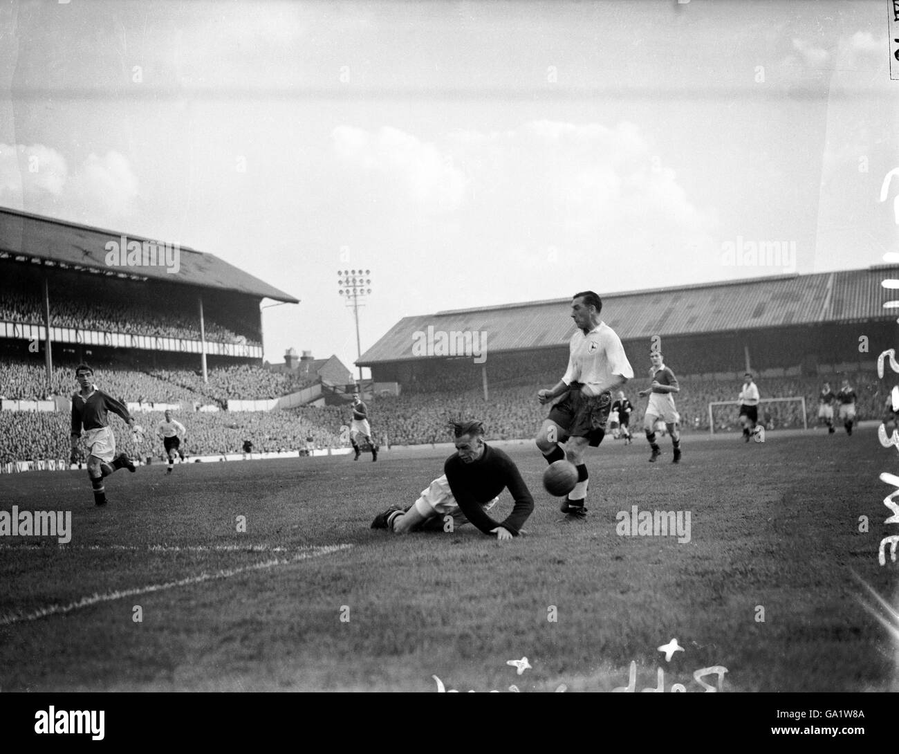 Manchester United goalkeeper Ray Wood (c) dives at the feet of ...
