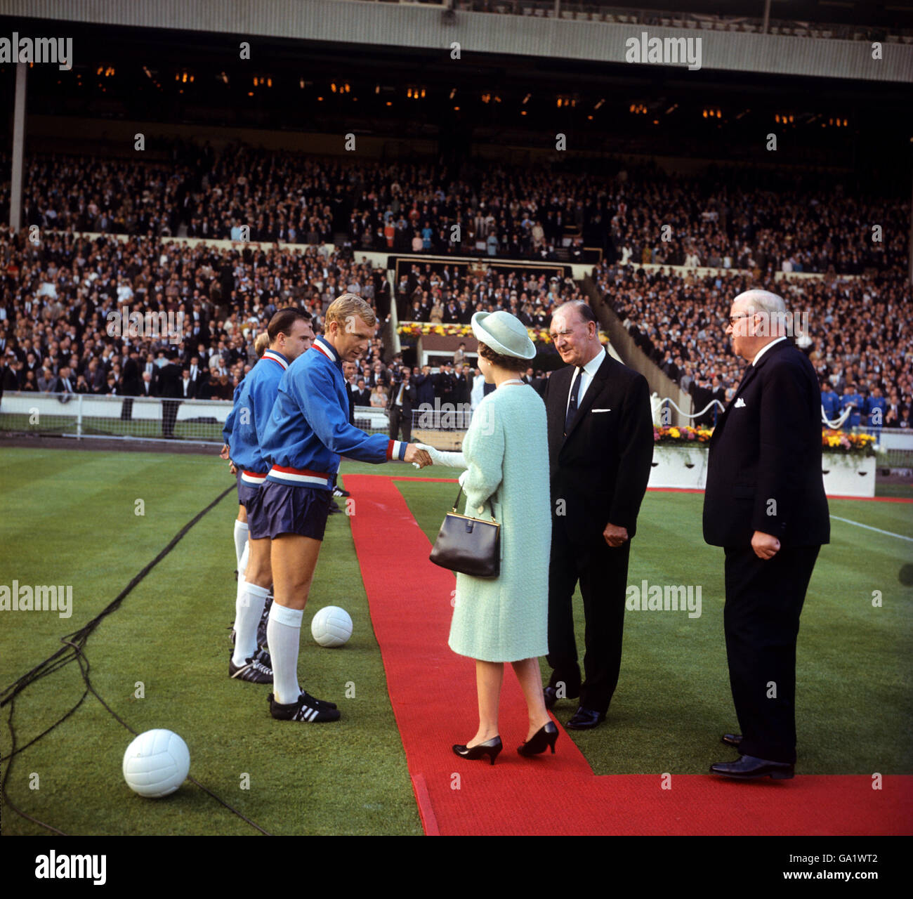 H.M. Queen meets England captain Bobby Moore before kick off Stock ...