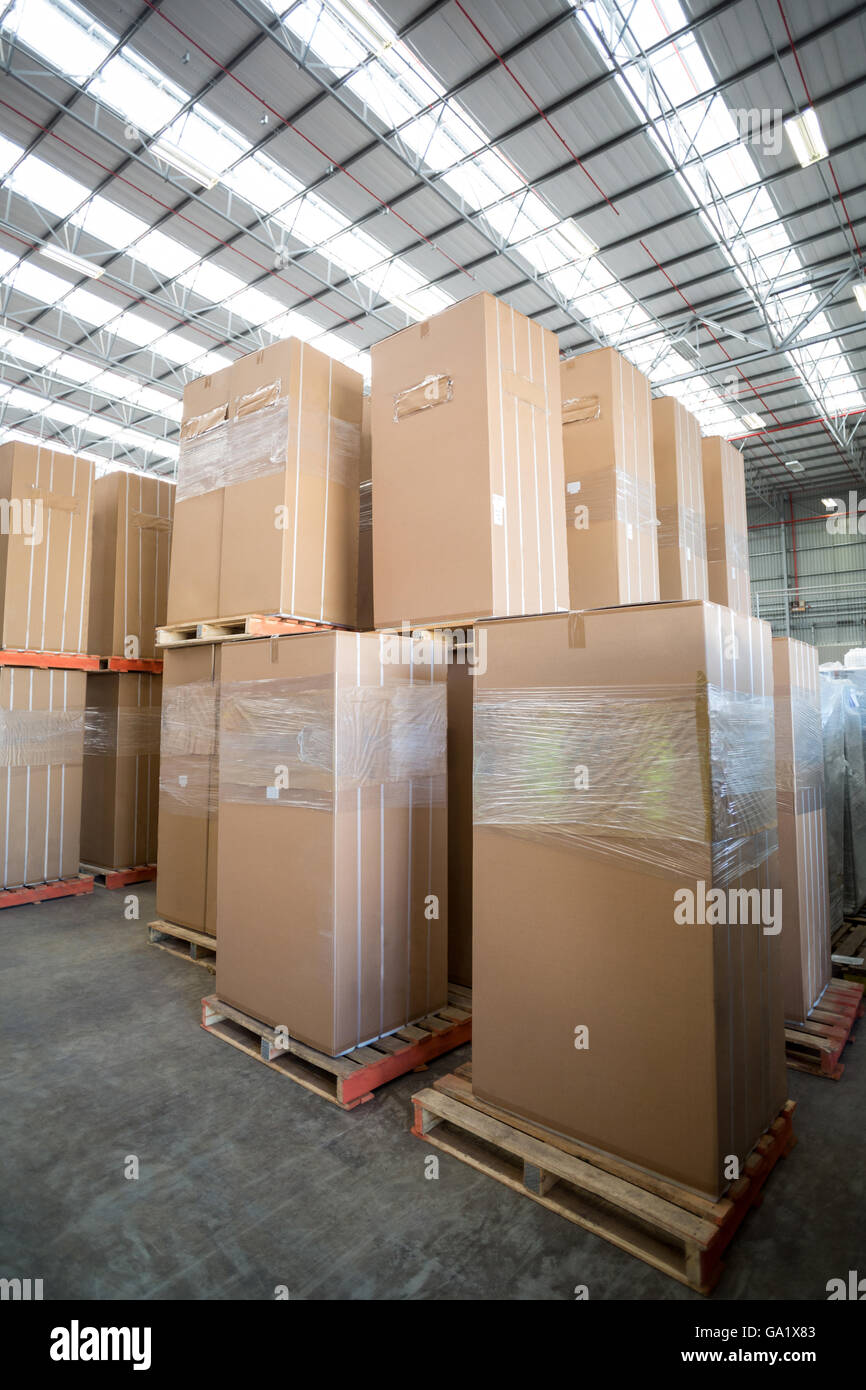 View of cardboard boxes put on pallets Stock Photo - Alamy