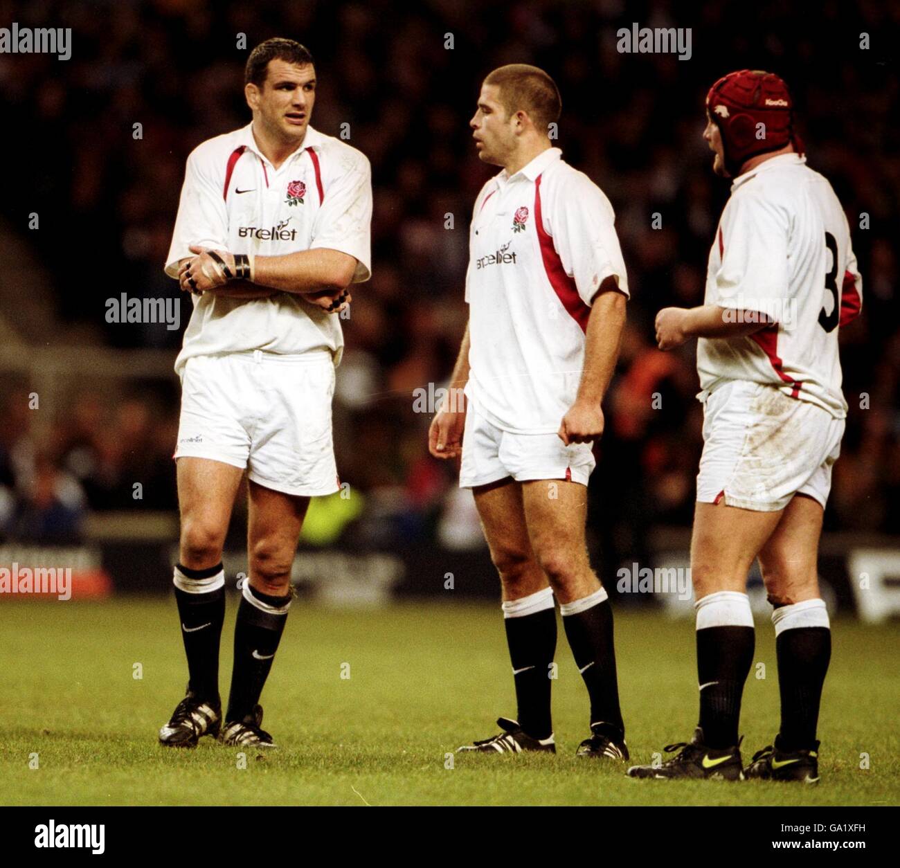 England's captain Martin Johnson holds his injured hand before going ...