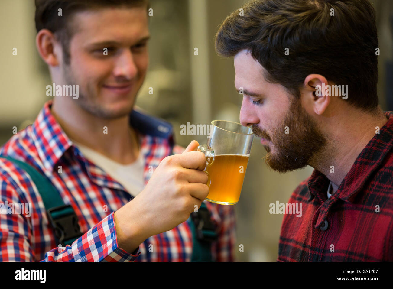 Brewers smelling beer Stock Photo - Alamy