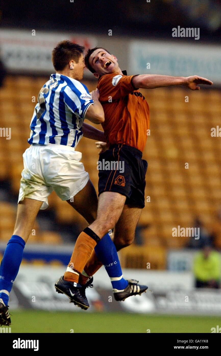 Sheffield Wednesday's Leigh Bromby (l) wins an aerial duel with ...